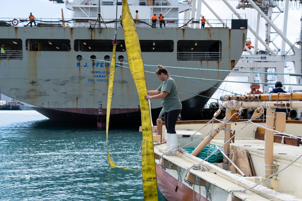 Watch: Voyaging canoe Hōkūle‘a lifted onto Matson ship for transport to ...